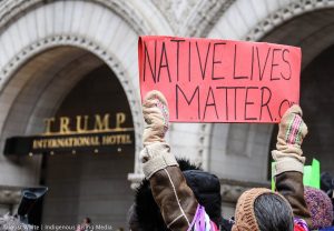 Activists and Native Americans march on Washington amid rain, sleet and ...