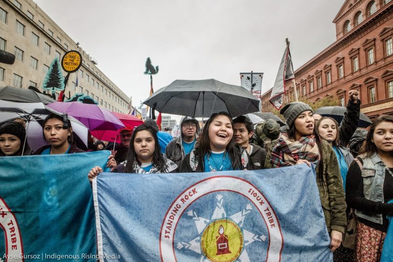 Activists and Native Americans march on Washington amid rain, sleet and ...