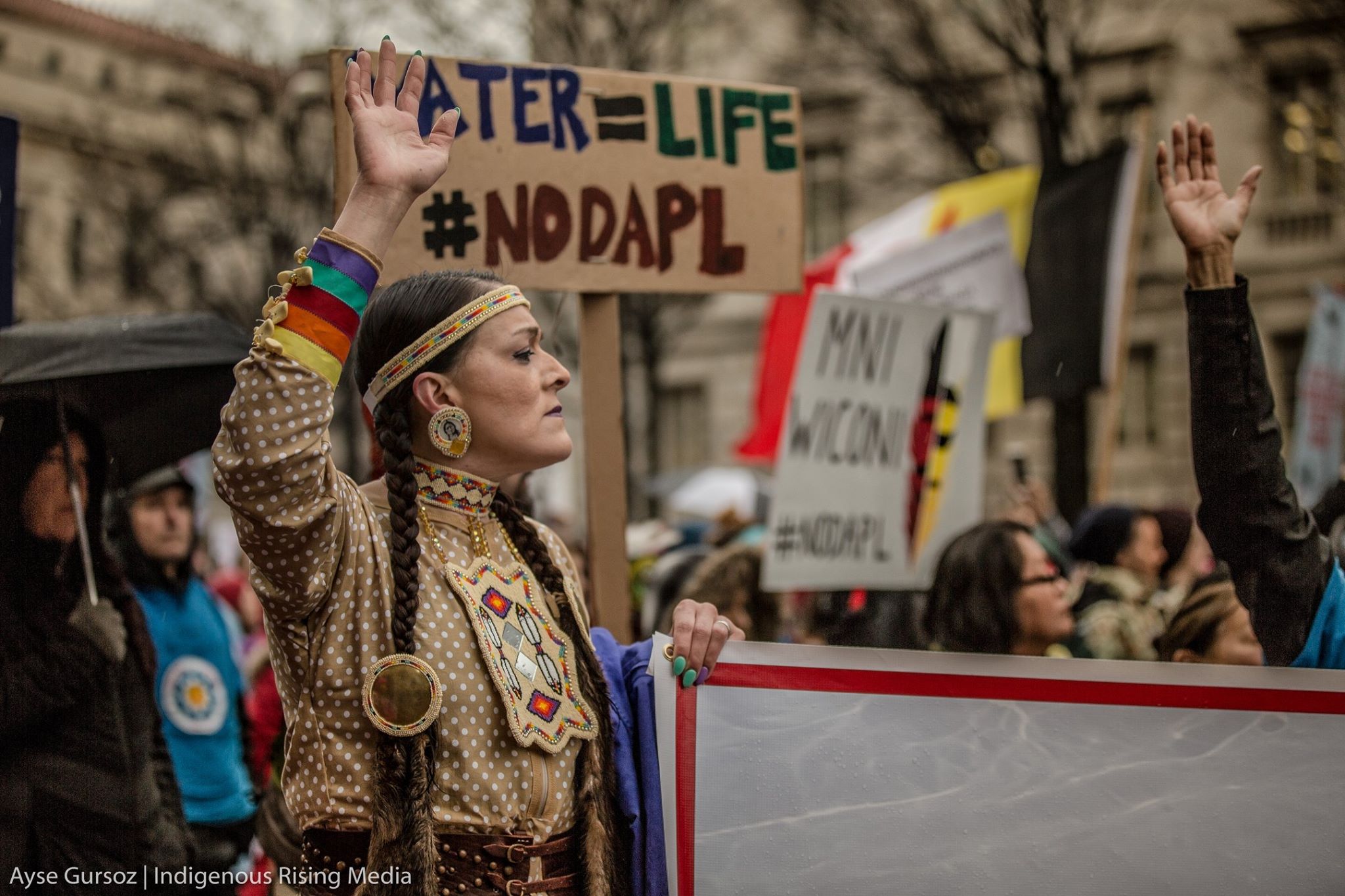 Activists and Native Americans march on Washington amid rain, sleet and ...