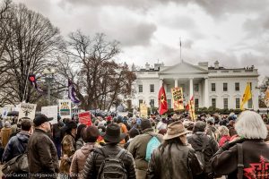 Activists and Native Americans march on Washington amid rain, sleet and ...